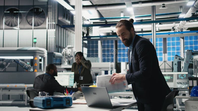 Executive Manager in Suit Conducting an Inspection in a Solar Panel ...