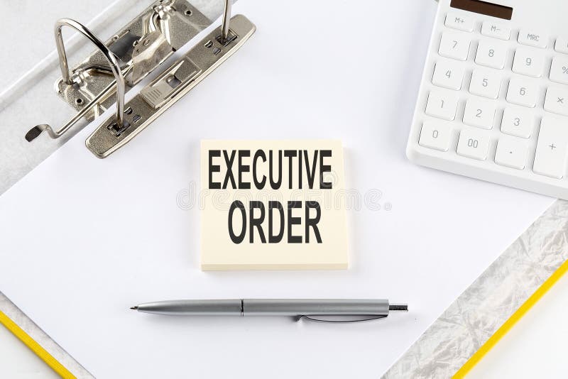EXECUTIVE ORDER Text on Notebook with Chart, Calculator and Pen Stock ...