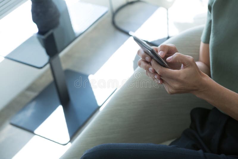 Executive Sitting on Chair Using Mobile Phone in the Office Stock Photo ...