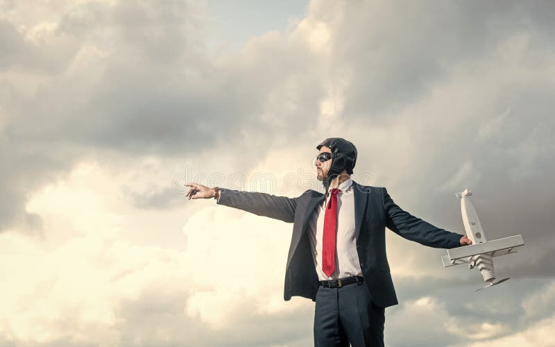 Executive in Suit and Pilot Hat Launch Plane Toy on Sky Background ...