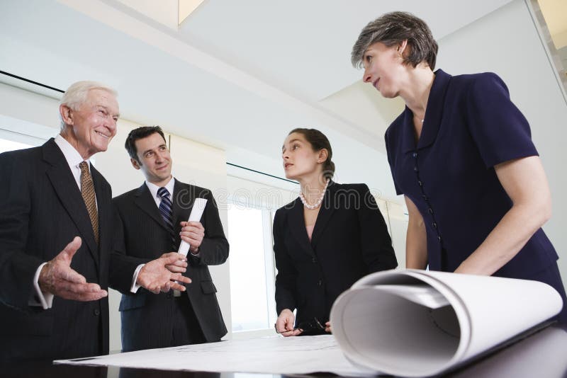 Executive Team Reviewing Plans. Stock Image - Image of marble, designs ...