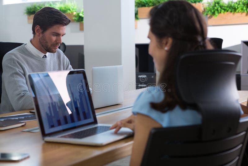 Executive Using Laptop at the Desk Stock Photo - Image of browsing ...