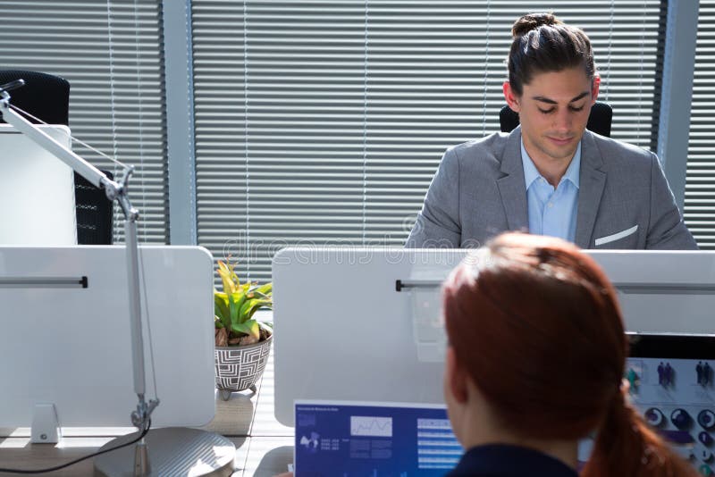 Executive Working Together at Desk Stock Photo - Image of business ...