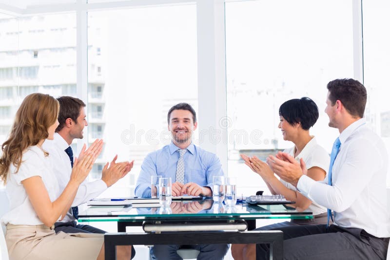 Executives Clapping Around Conference Table Stock Photo - Image of ...