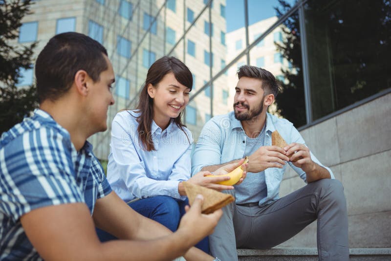 Executives Having Breakfast Outside Office Building Stock Photo - Image ...
