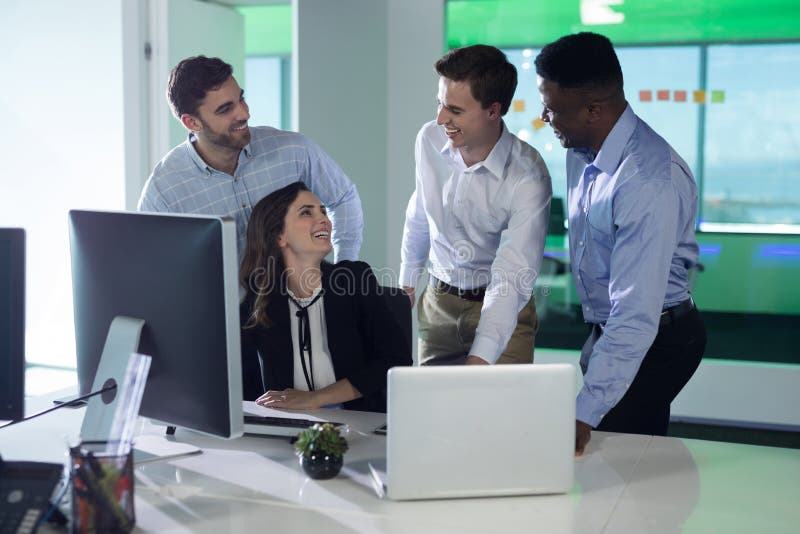 Executives Interacting while Working on Personal Computer Stock Image ...