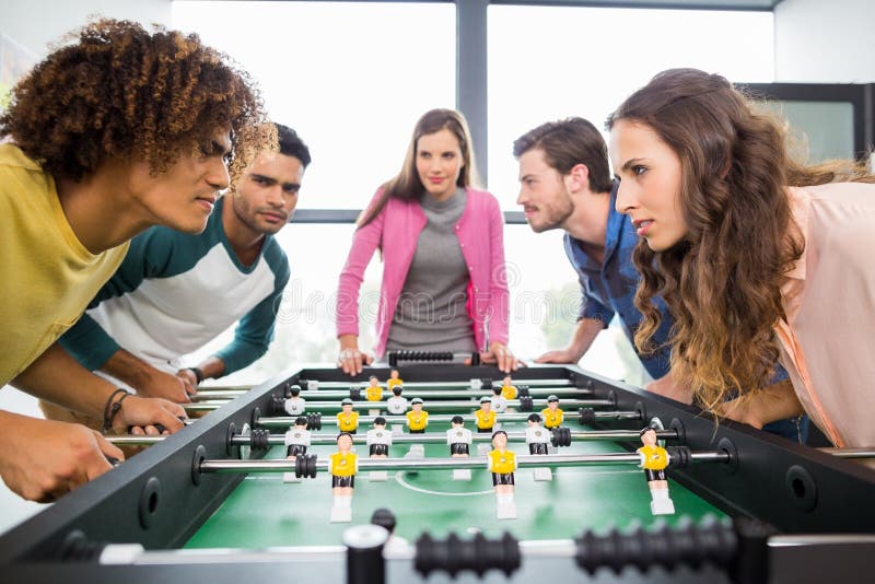 Executives Playing Table Football Stock Photo - Image of expertise ...