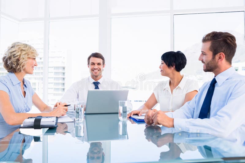 Executives Sitting Around Conference Table Stock Photo - Image of ...