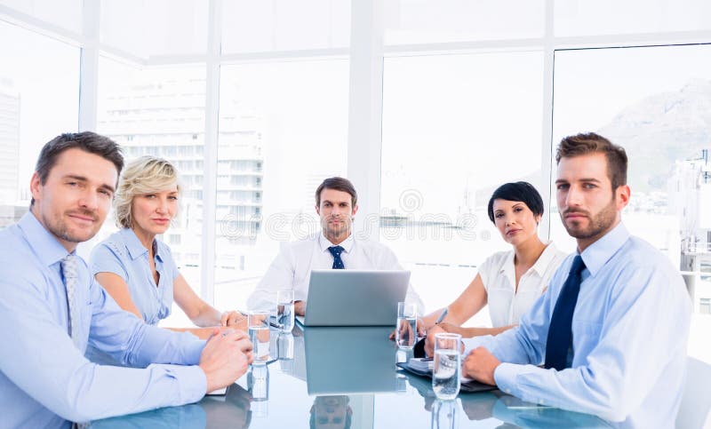 Executives Sitting Around Conference Table Stock Photo - Image of ...