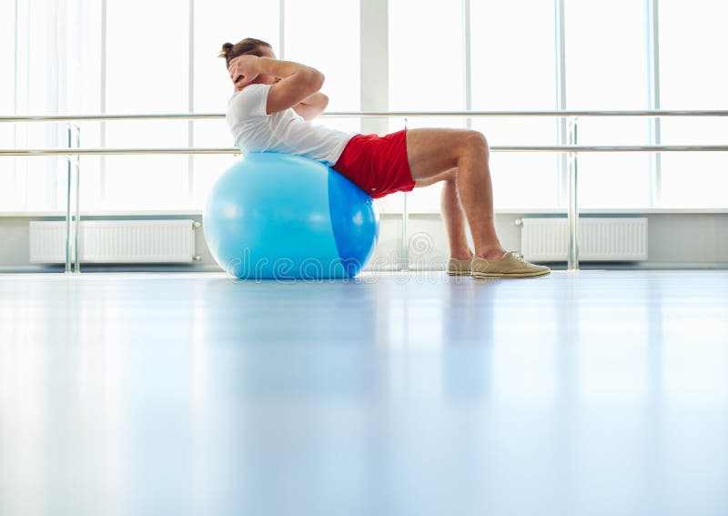 Exercise on ball stock image. Image of energetic, active - 57562093