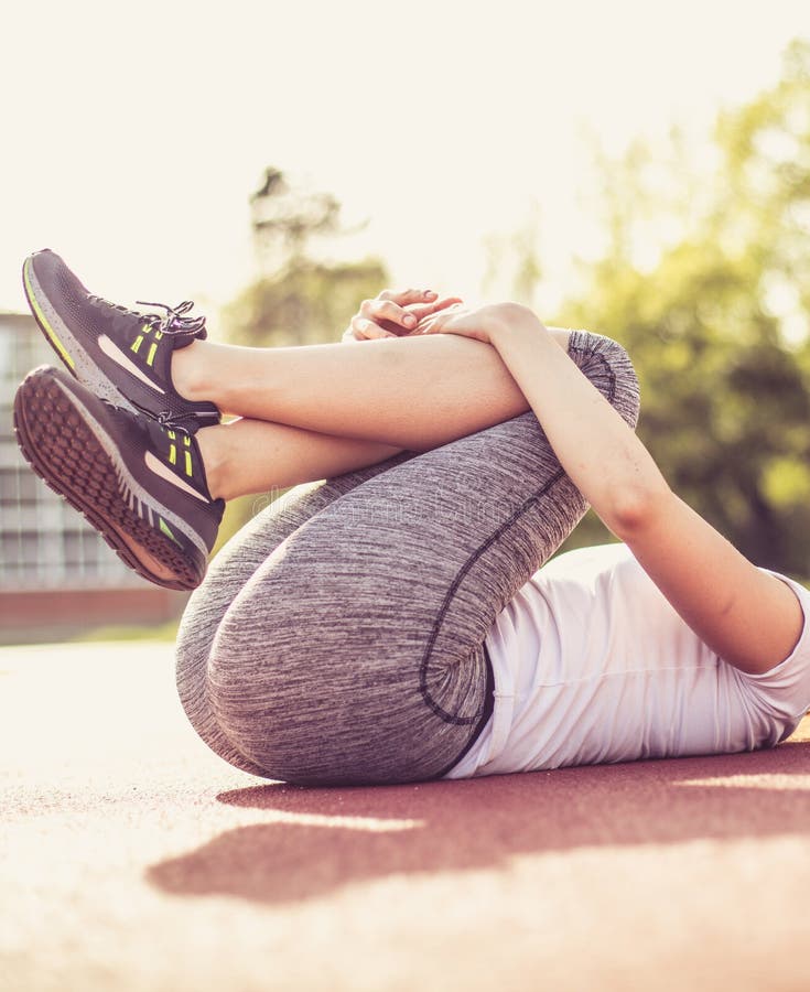 Exercise for her legs. stock photo. Image of body, outdoors - 129653786