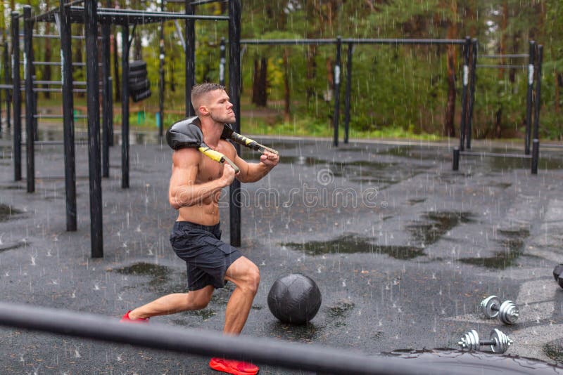 Sportsman Having Rest after Hard Workout Outdoor in a Rainy Day. Man ...