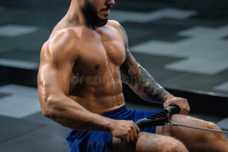Exercise on rowing machine stock image. Image of person - 188243799