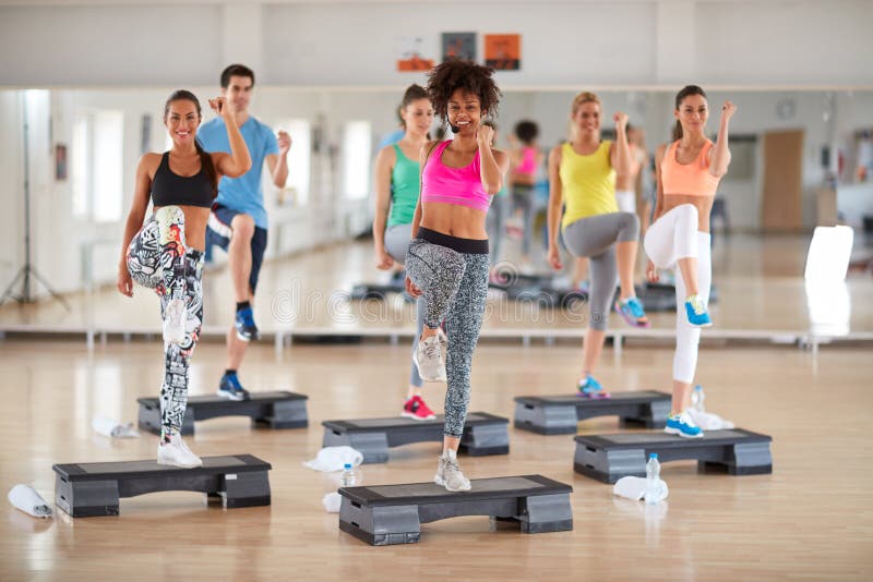 Exercisers with Female Instructor on Group Training Stock Photo - Image ...
