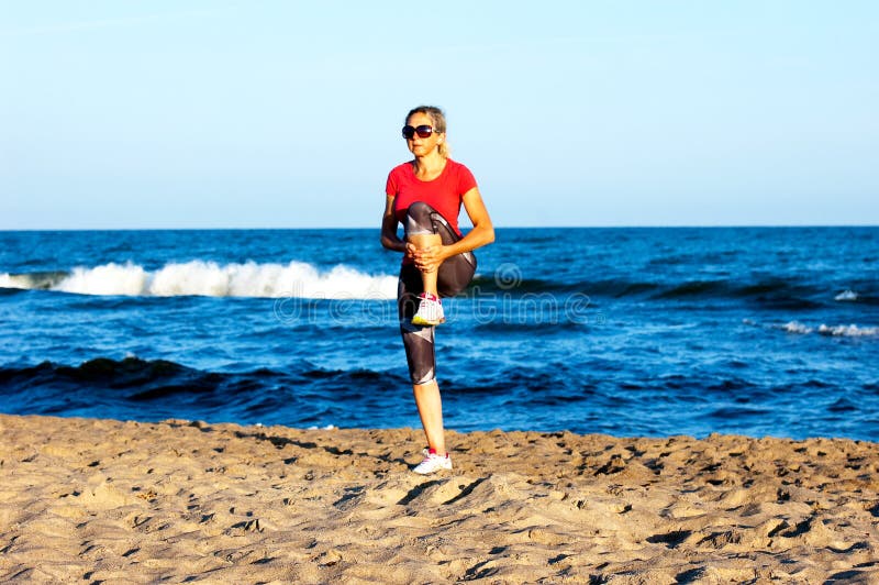 Exercises on the beach stock photo. Image of activity - 123576326