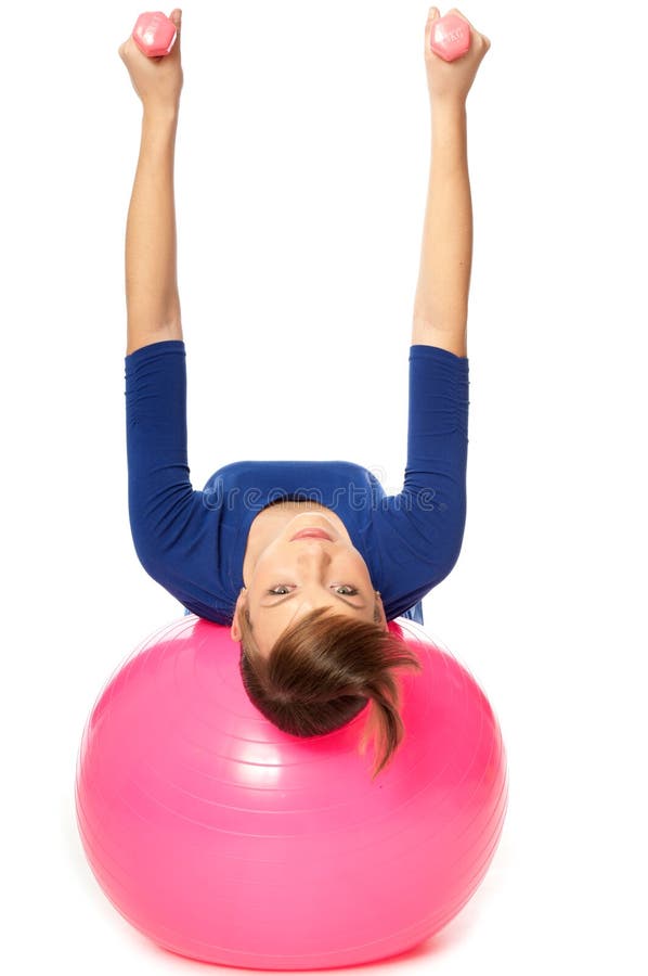 Exercises with Dumbbells on a Gymnastic Ball Stock Photo - Image of ...
