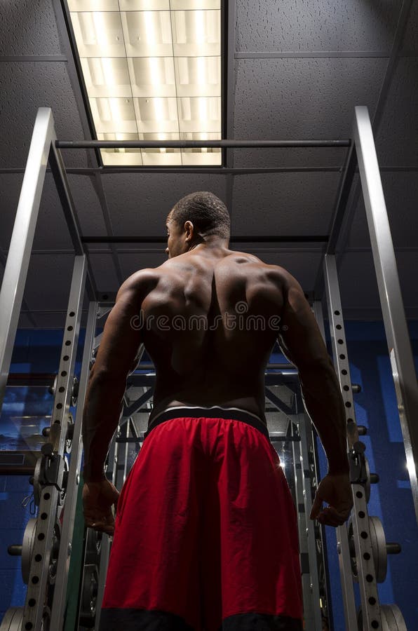 Exercising in Dramatic Light Stock Image - Image of lifting, color ...