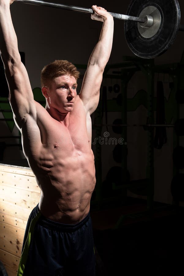 Exercising in Dramatic Light Stock Image - Image of lighting, defined ...