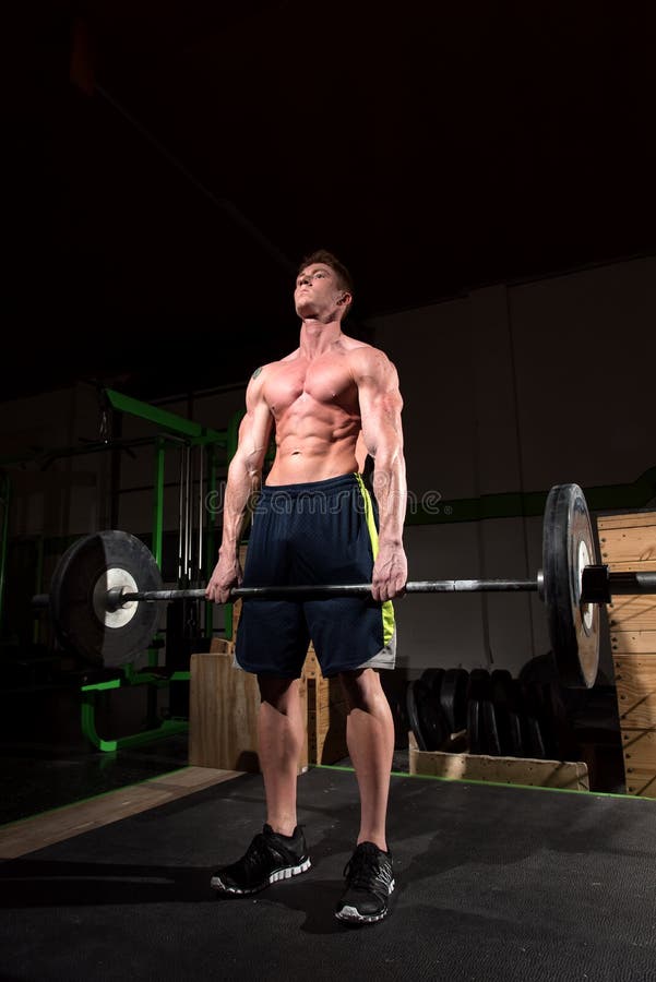 Exercising in Dramatic Light Stock Photo - Image of athlete, motivation ...
