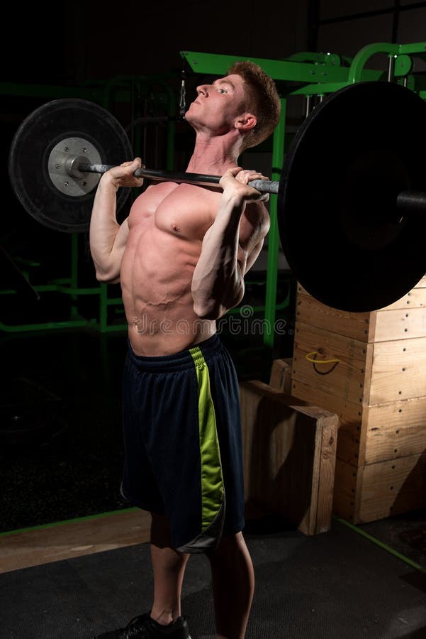 Exercising in Dramatic Light Stock Photo - Image of ripped ...