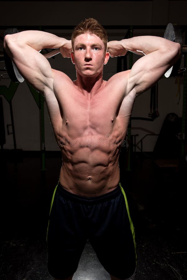 Exercising in Dramatic Light Stock Image - Image of color, determined ...