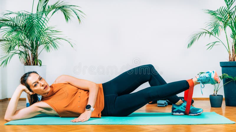 Exercising at Home. Woman Using Elastic Band for Strength Training ...