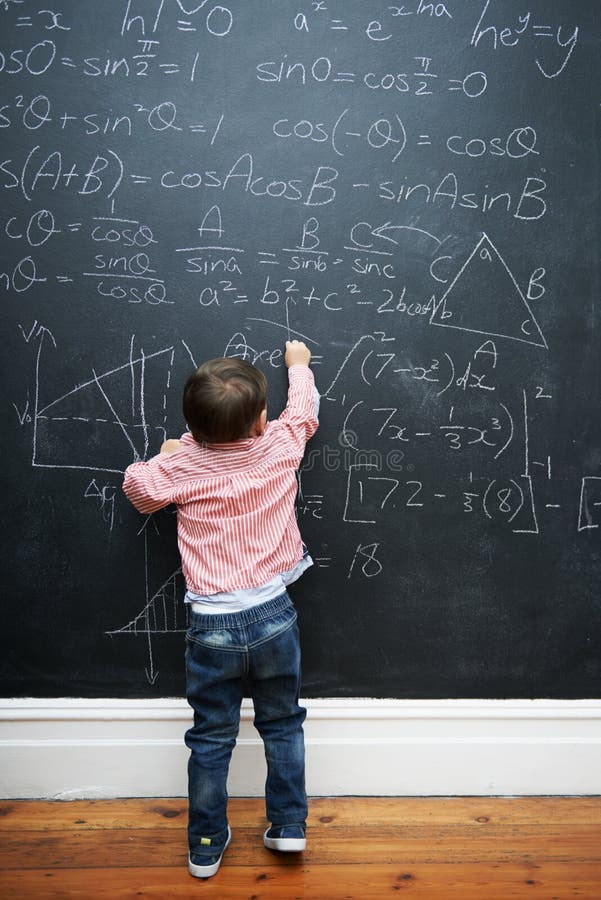 Exercising the Mind. Studio Shot of a Young Boy with a Blackboard Full ...