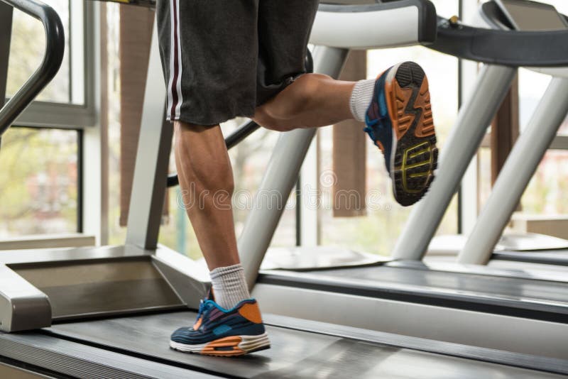 Exercising on a Treadmill stock photo. Image of athletic - 58871040