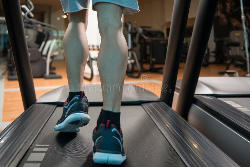 Exercising on a Treadmill Close-Up Stock Photo - Image of muscle ...