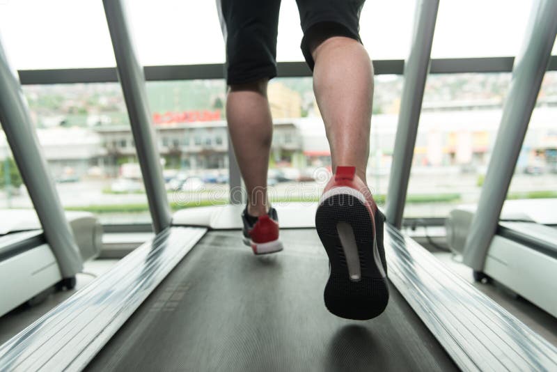 Exercising on a Treadmill Close-Up Stock Image - Image of ankles ...