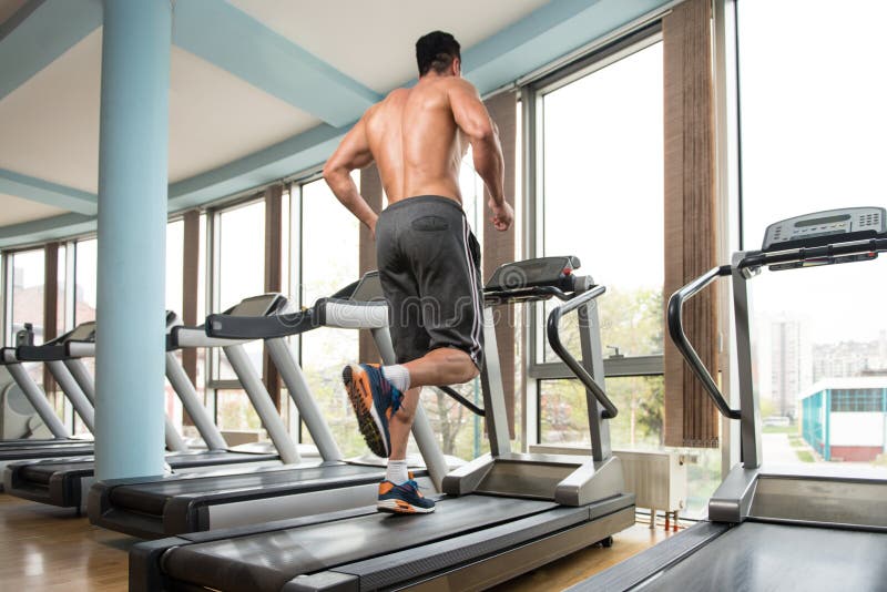 Exercising on a Treadmill stock image. Image of exercise - 58870991