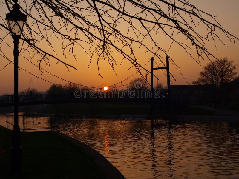 Exeter sunset stock image. Image of branch, tree, bank - 82288105