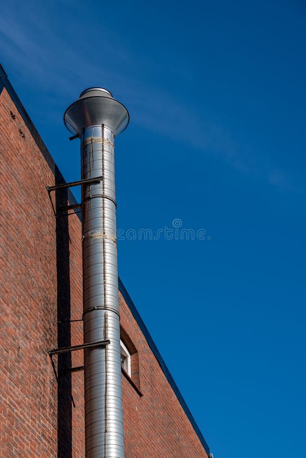 An Exhaust Pipe on a House Wall Stock Photo - Image of iron, building ...