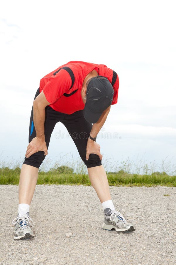 Exhausted Runner Man Resting after Workout Stock Photo - Image of ...