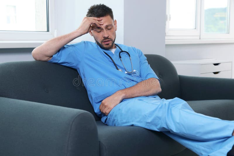 Exhausted Doctor Resting on Sofa in Hospital Stock Image - Image of ...