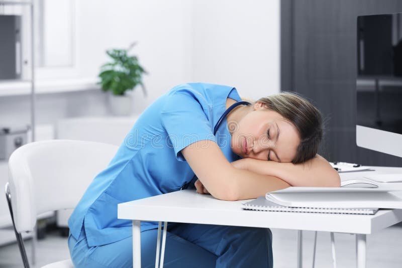 Exhausted Doctor Sleeping at Workplace in Hospital Stock Image - Image ...