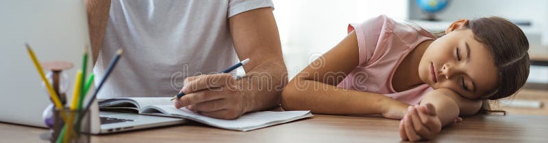 The Exhausted Father and a Daughter Doing Homework at the Table. Stock ...