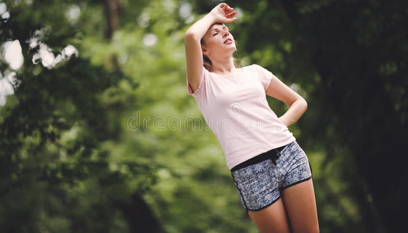 Exhausted Female Jogger Grasping for Air Stock Photo - Image of bright ...