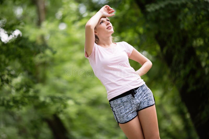 Exhausted Female Jogger Grasping for Air Stock Photo - Image of runner ...