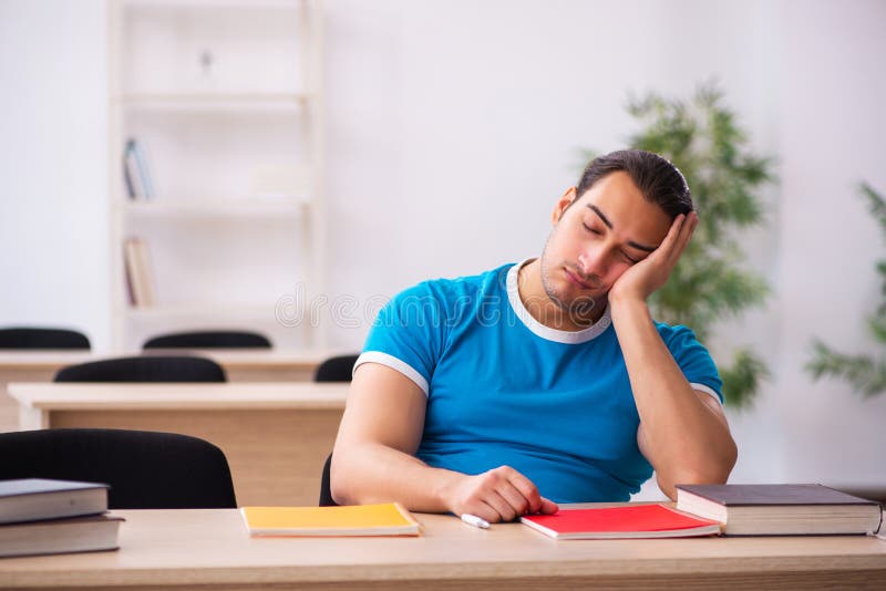 Exhausted Male Student Preparing for the Exams in the Classroom Stock ...