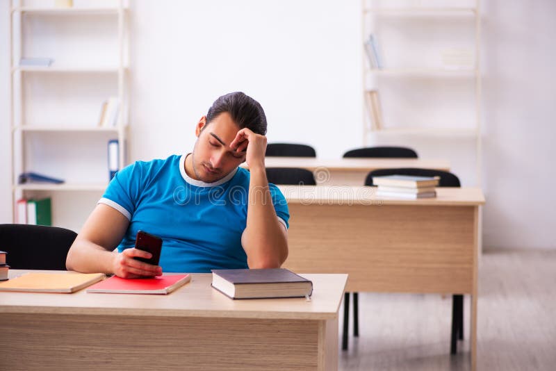 Exhausted Male Student Preparing for the Exams in the Classroom Stock ...
