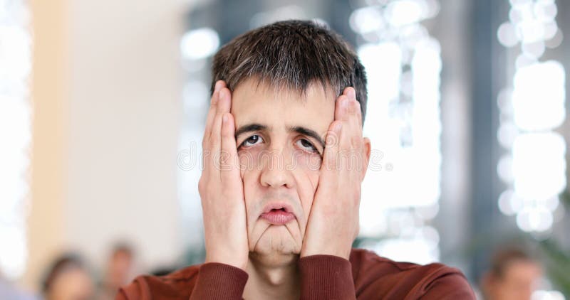 Sad Man Pulling on Face stock photo. Image of depression - 28126156