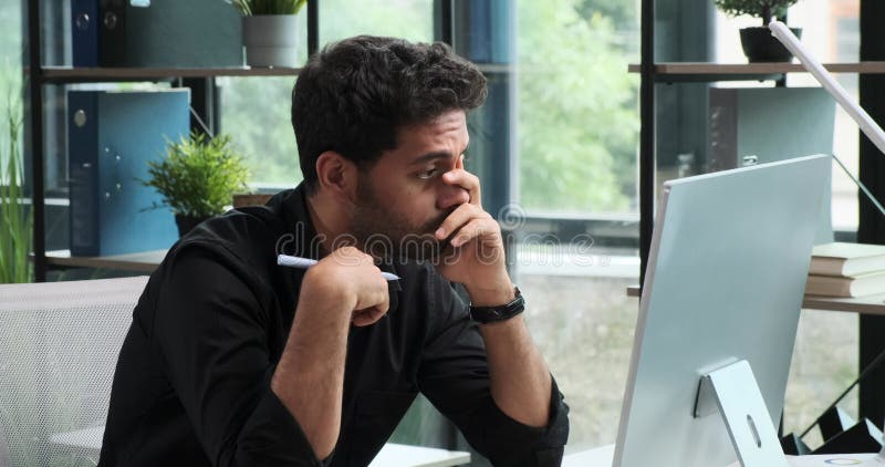 Distressed Male Employee Deep in Thought while Working on Computer ...