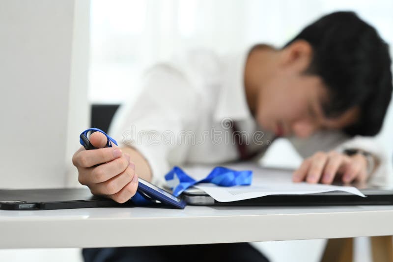 Exhausted Office Worker Falling Asleep on His Desk. Fatigue in the ...