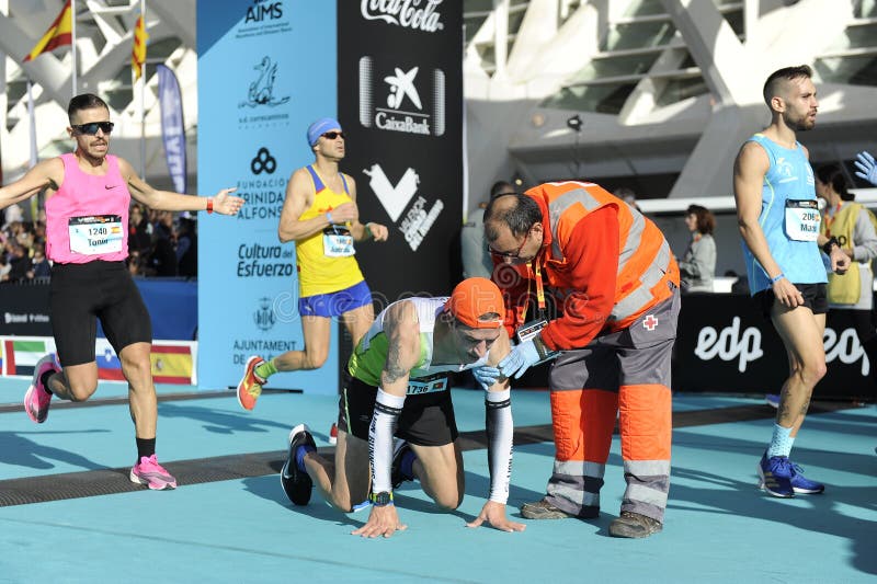 Exhausted Runner at the Finish Line of the Valencia 2019 Marathon ...