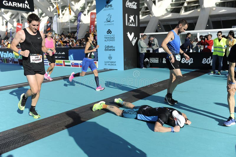 Exhausted Runner at the Finish Line of the Valencia 2019 Marathon ...