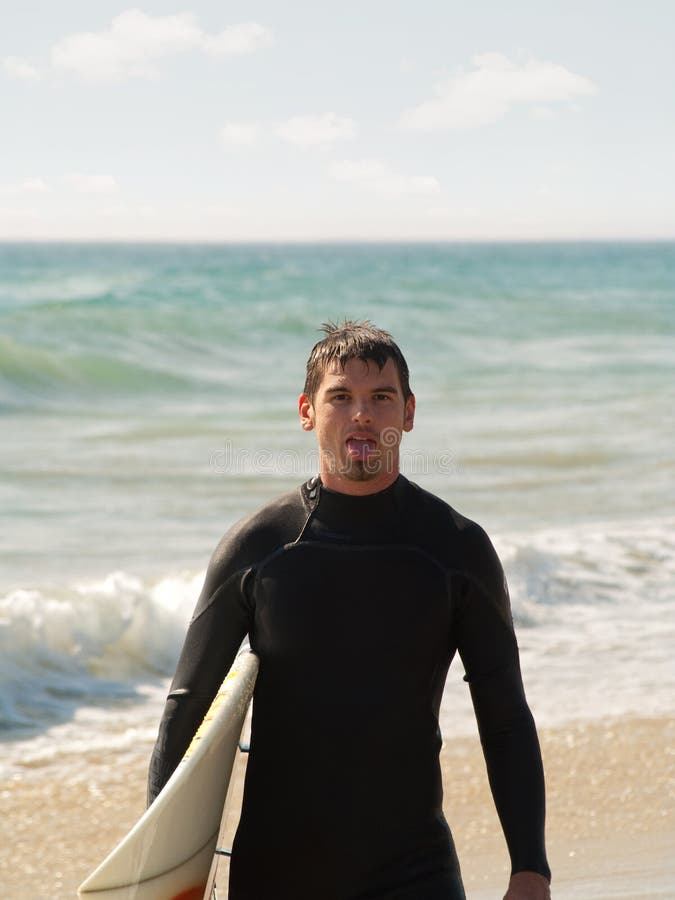 Exhausted Surfer after Session Stock Photo - Image of tongue, wetsuit ...