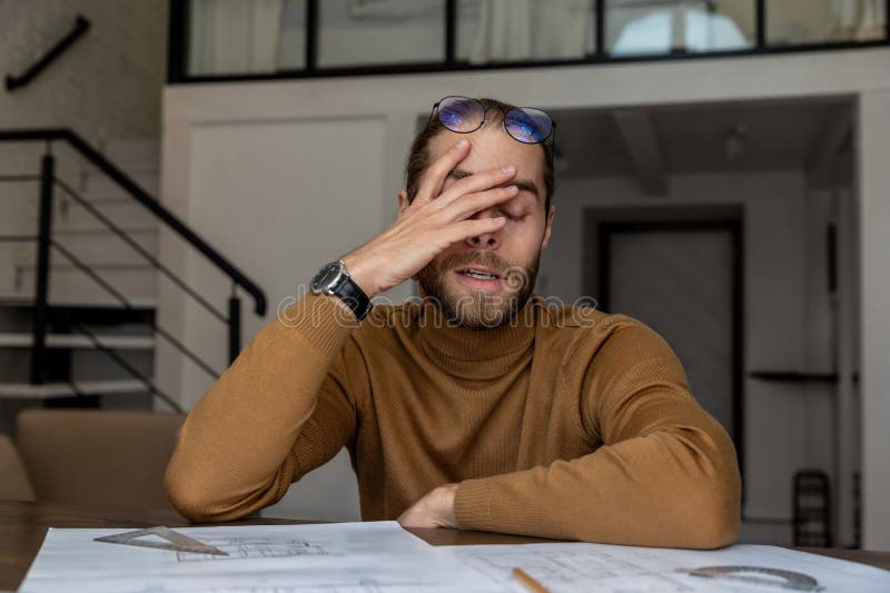 Exhausted Tired Engineer Architect Working on Design of House, Creating ... Exhausted Tired Engineer Architect Working on Design of House, Creating ...