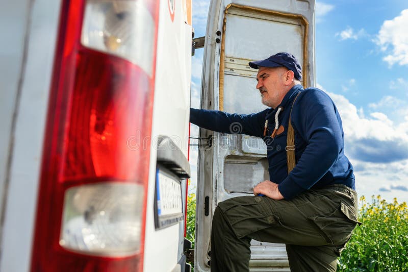 Tired Truck Driver is Opening the Trunk of His Van Stock Image - Image ...