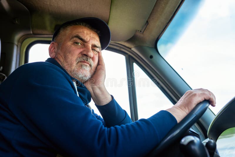 Exhausted Truck Driver Looking at the Camera. Stock Image - Image of ...